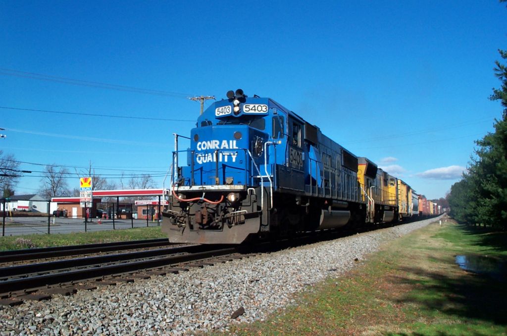 NS 5403 and a UP engine lead this train towards Greensboro